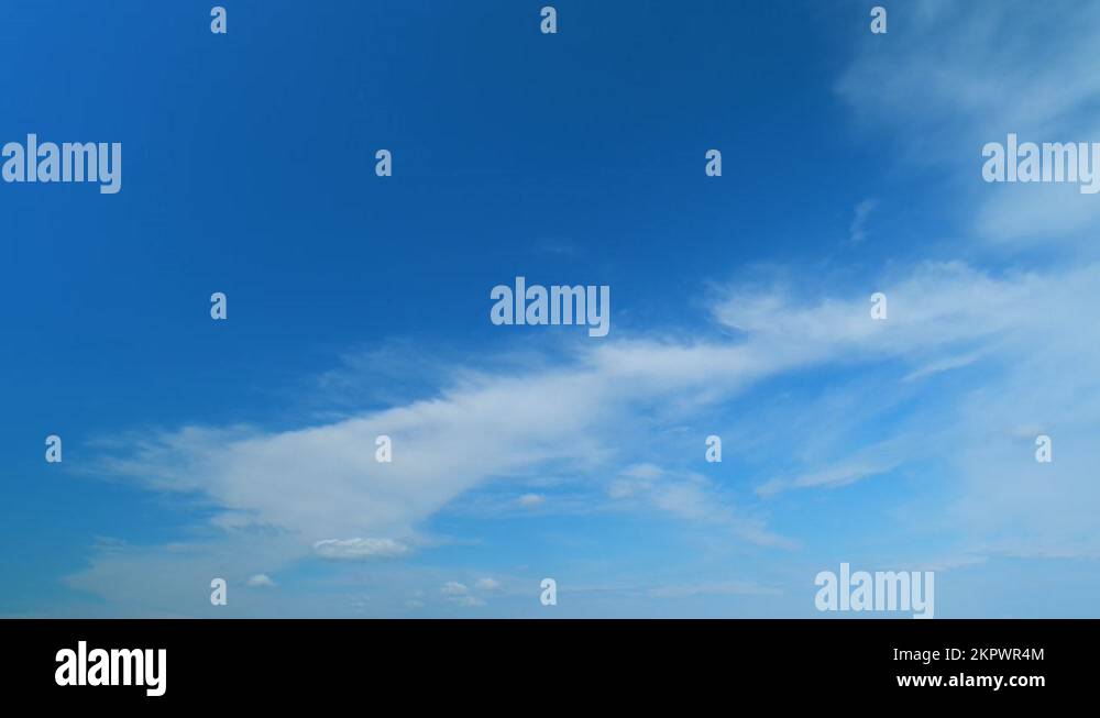 Sky with several layers of clouds moving in different directions. Sun ...