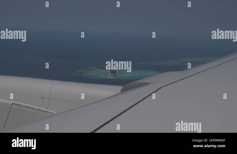A view from a plane window, above the Maldives Islands Full HD slow ...