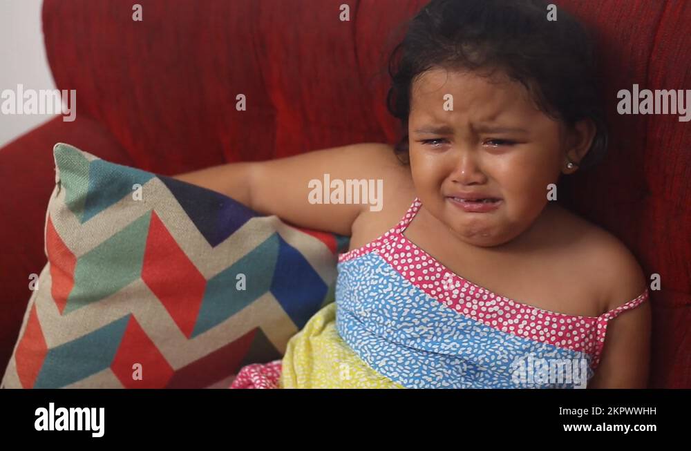 Cute asian little girl eating while crying at home and almost choked ...
