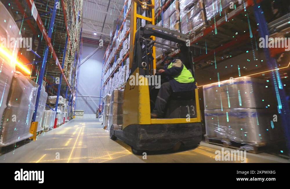 Forklift in a warehouse. Forklift in a large modern warehouse with ...