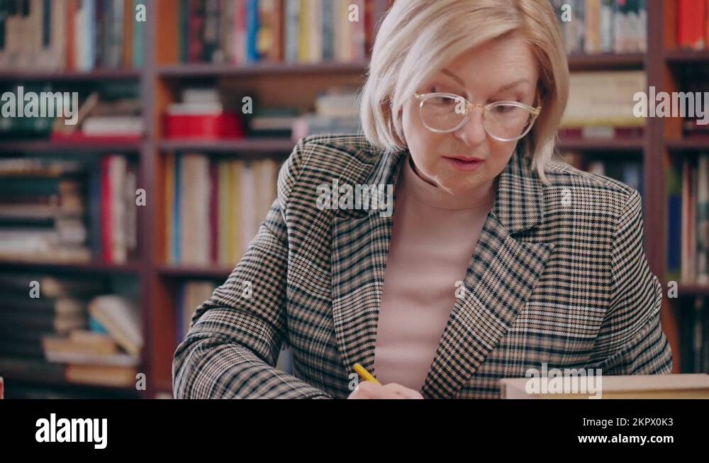 Teacher grading homework in classroom Stock Videos & Footage - HD and ...