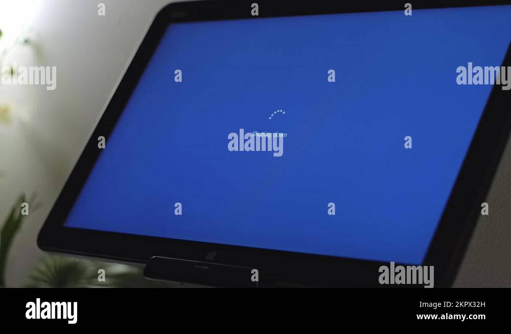 A dell 2 in 1 computer showing Windows 10 shutting down screen Stock ...