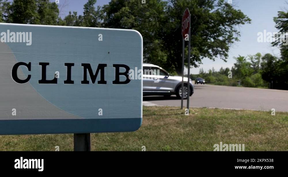 Sleeping Bear sand dunes in Michigan showing Dune Climb sign and car ...