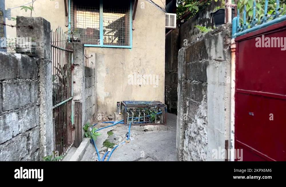 Walking Through an Alley in a Slum Neighborhood Stock Video Footage - Alamy