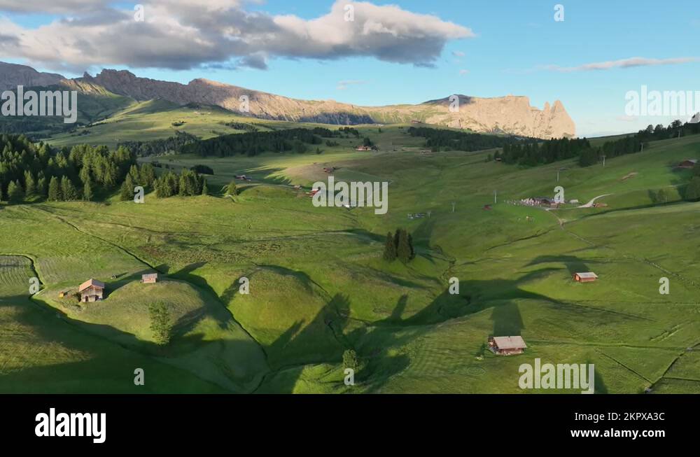 Aerial view of Seiser Alm valley with traditional wooden mountain huts ...