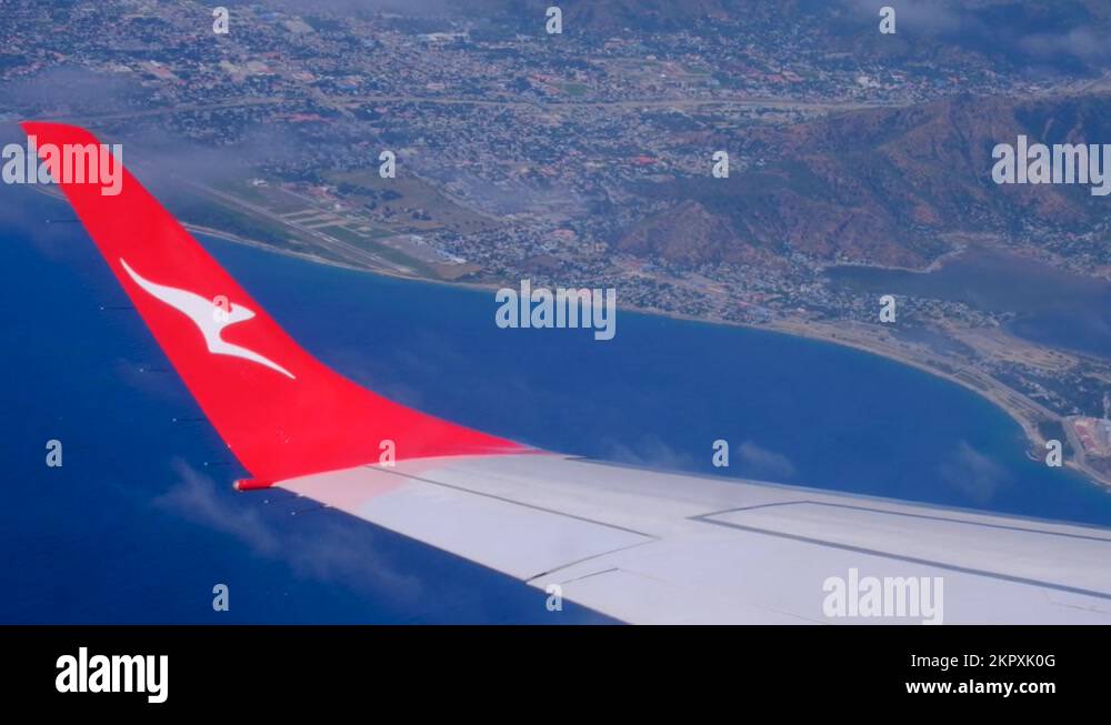 Qantas plane with kangaroo logo on wing, flight arriving in Dili Timor ...