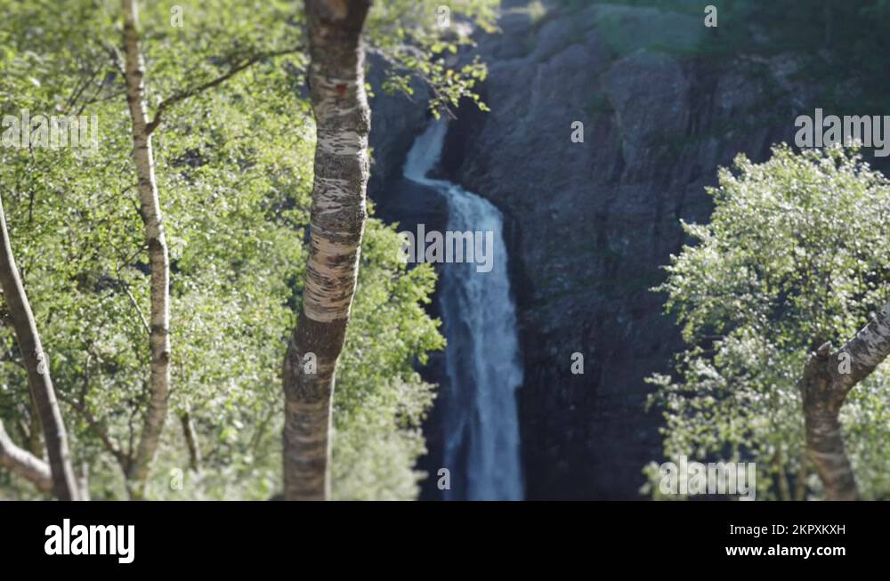 A view of the waterfall falling into a deep gorge. Pan backward Stock ...
