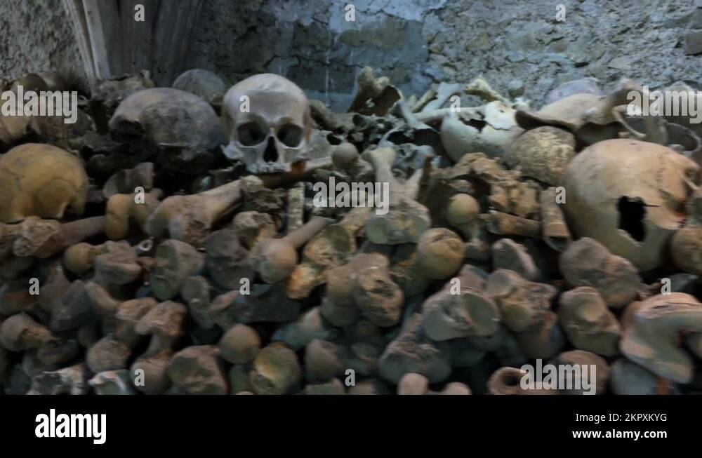 Ancient human skulls and bones in the Ossuary (crypt) at St Leonard’s ...
