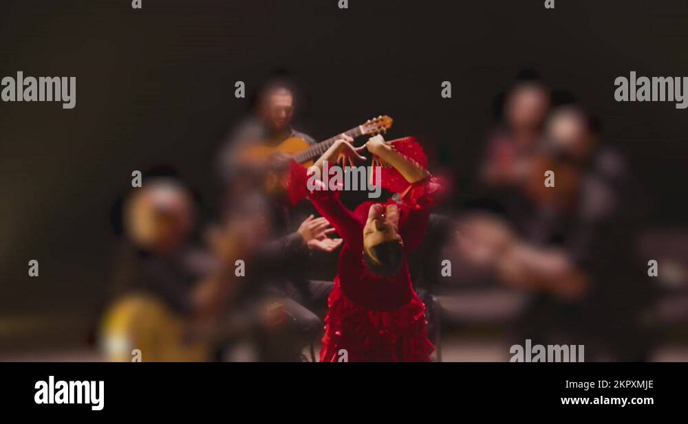 Woman dancing spanish style dance . Group of men playing on guitar and ...