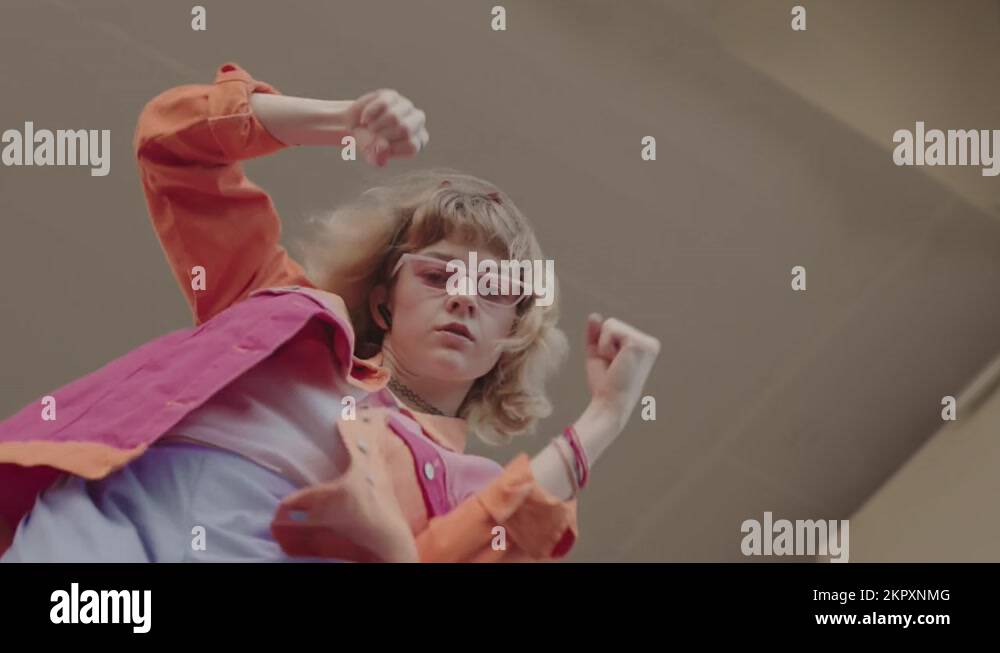Girl in Y2K Outfit Dancing Vogue Stock Video Footage - Alamy