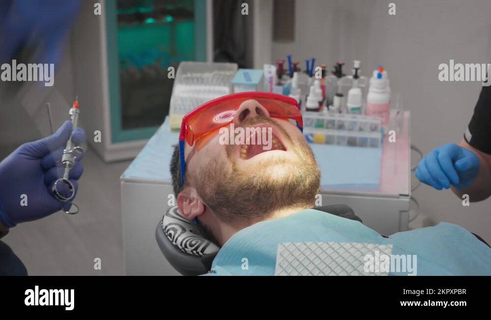 Dentist Injects Dental Anesthesia Syringe Into Gums During Teeth Care ...