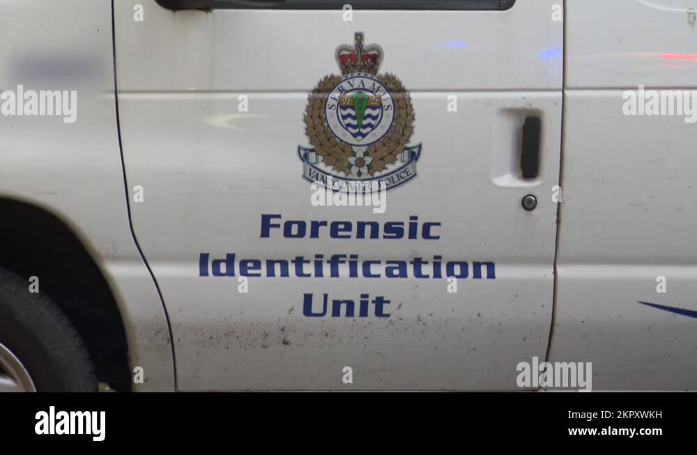 Forensic Identification Unit Van At Crime Scene W Police Car Flashing