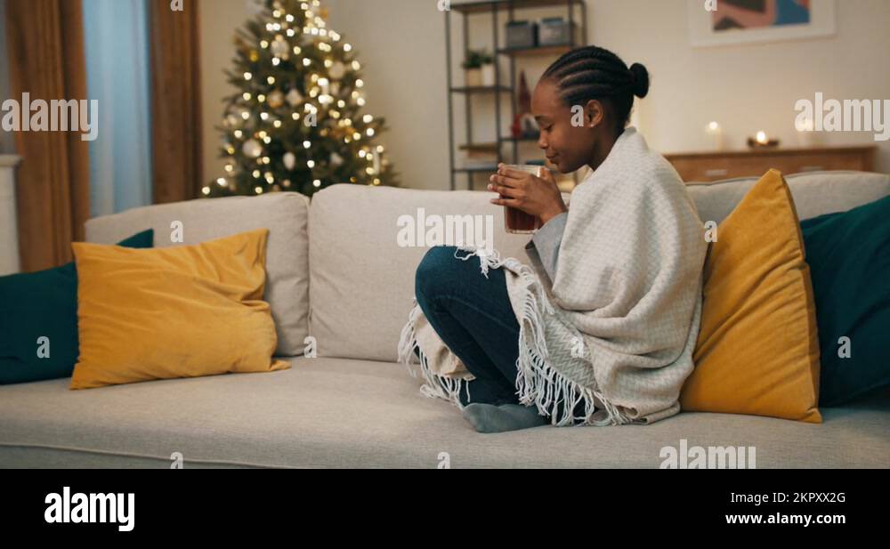 Woman sat on sofa Stock Videos & Footage - HD and 4K Video Clips - Alamy