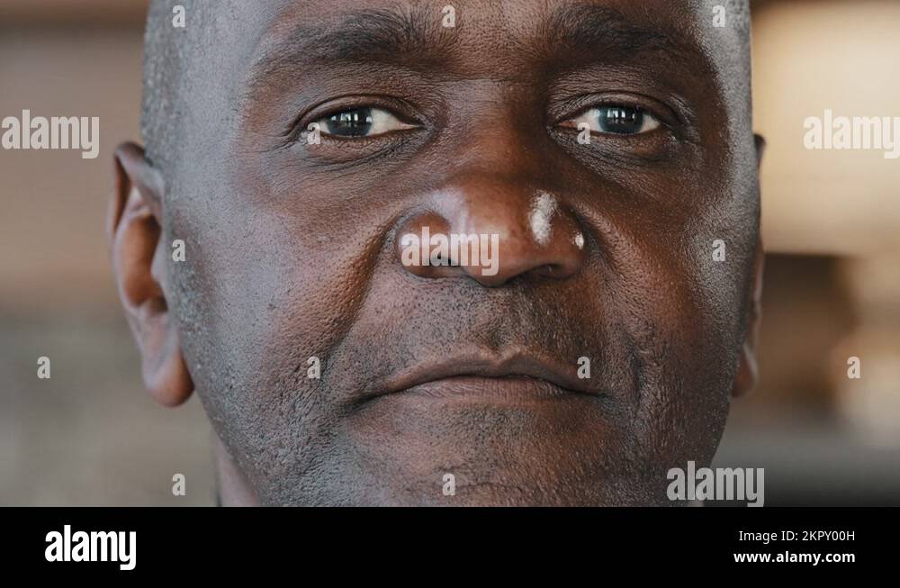 Close-up portrait african man concentrated human male wrinkled stubbly ...