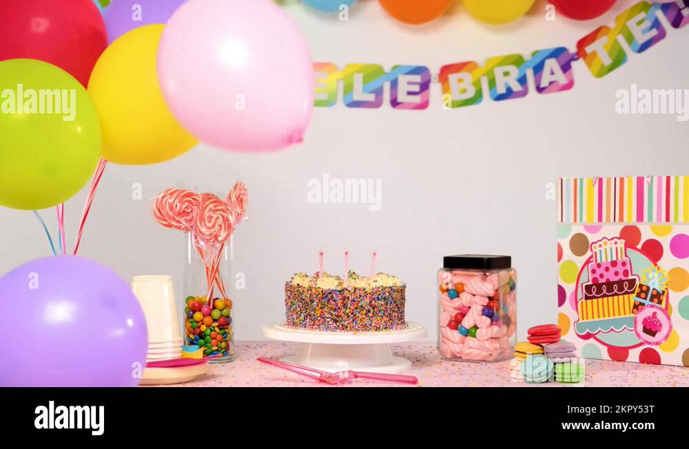 Birthday party table with balloon falling Stock Video Footage - Alamy