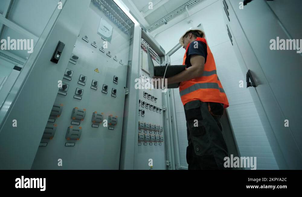 Electrical engineer working check the electric current voltage and ...