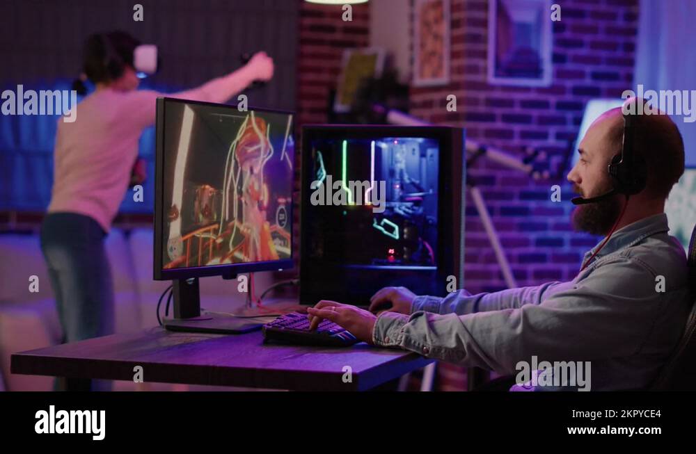 Man streaming multiplayer online first person shooter on pc while ...