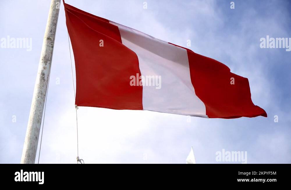 Peruvian Flag waving on a windy day in daytime, up-close blue skies ...