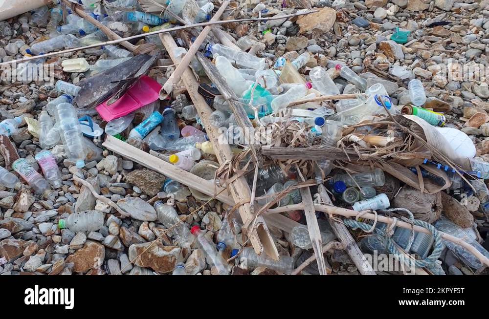 A messy entanglement of plastic waste, bottles, fishing nets, ropes ...