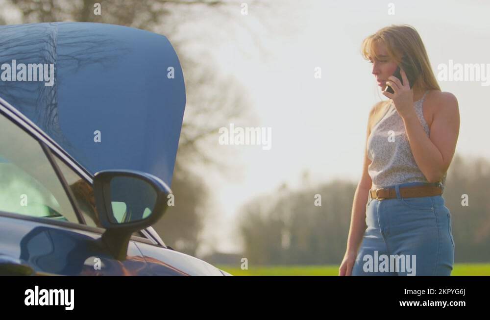 Frustrated Woman With Broken Down Car On Country Road Calling For Help ...