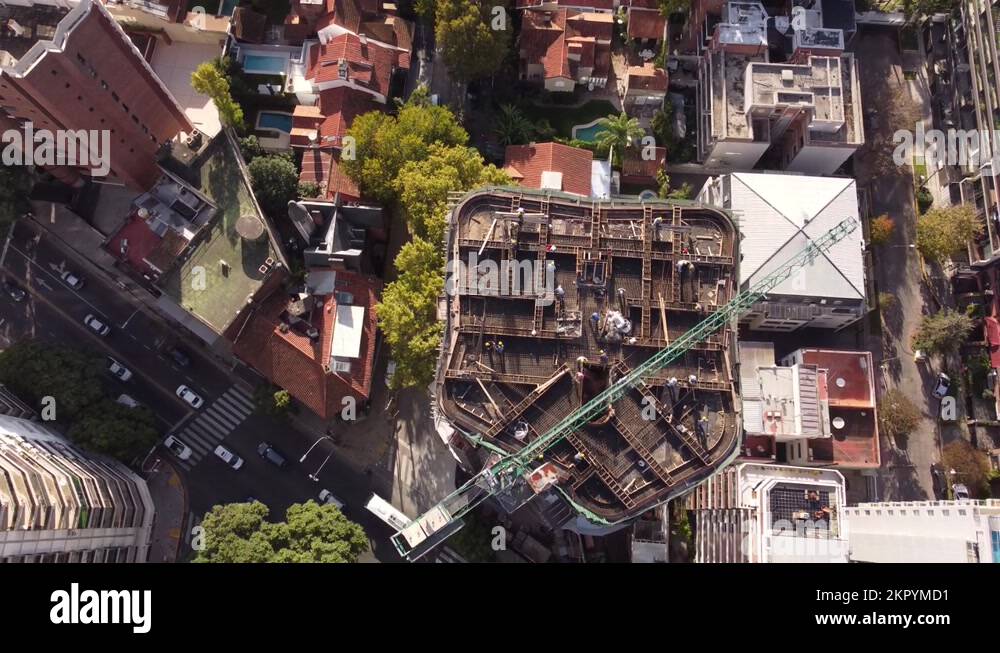 Rising aerial view of construction site on high rise building Stock ...