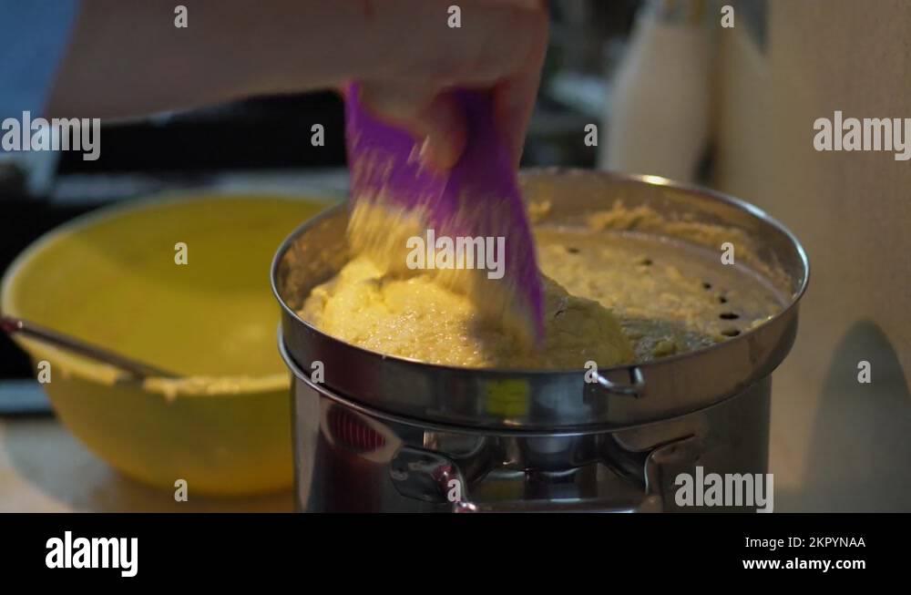Making Boiled Lumps Of Potato Dough (Halusky) With Spaetzle Maker Stock ...
