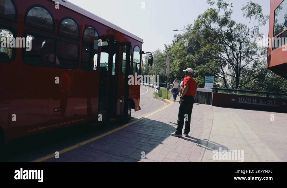 Tourist Passengers Boarding A Red Trolley Bus In Anchorage. Anchorage ...