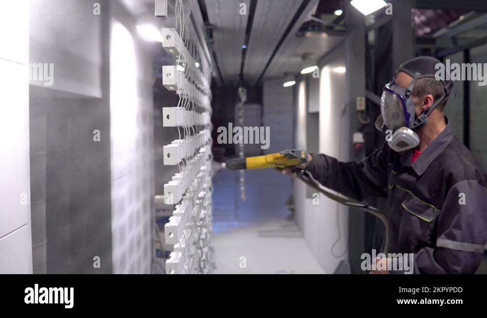 Powder coating of metal products. An employee in a Stock Video Footage ...