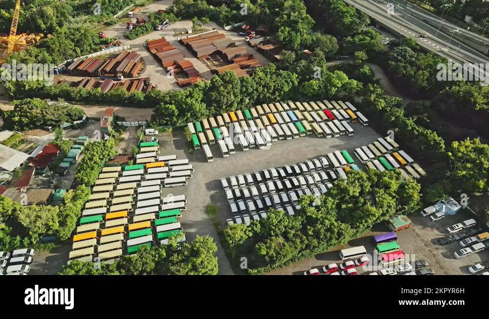 Minibuses parked at depot during COVID-19 pandemic, Hong Kong; drone ...