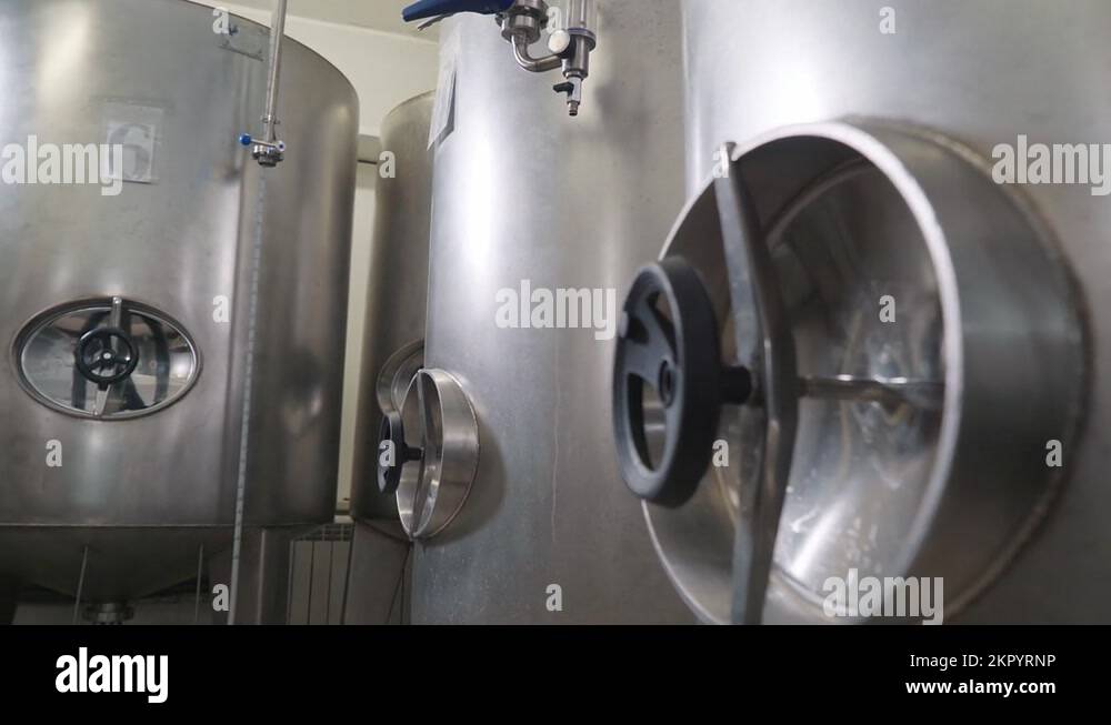 Multiple steel container tanks filled up with alcoholic drinks at the ...