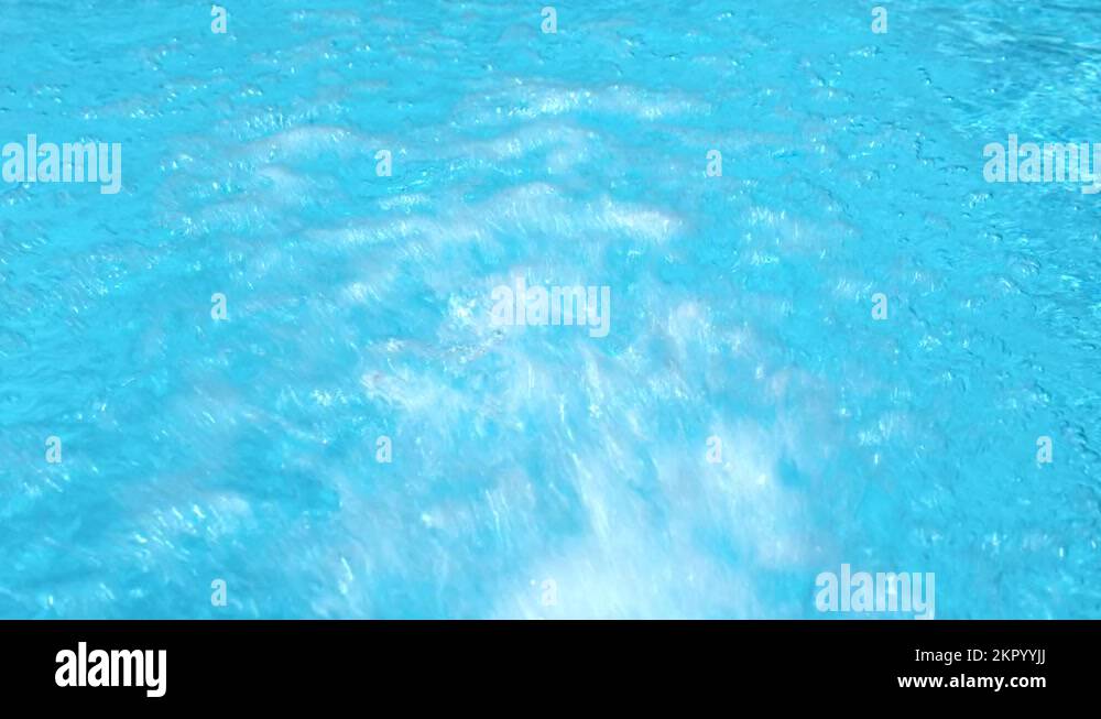 Transparent water movement from filtration in swimming pool with mosaic ...