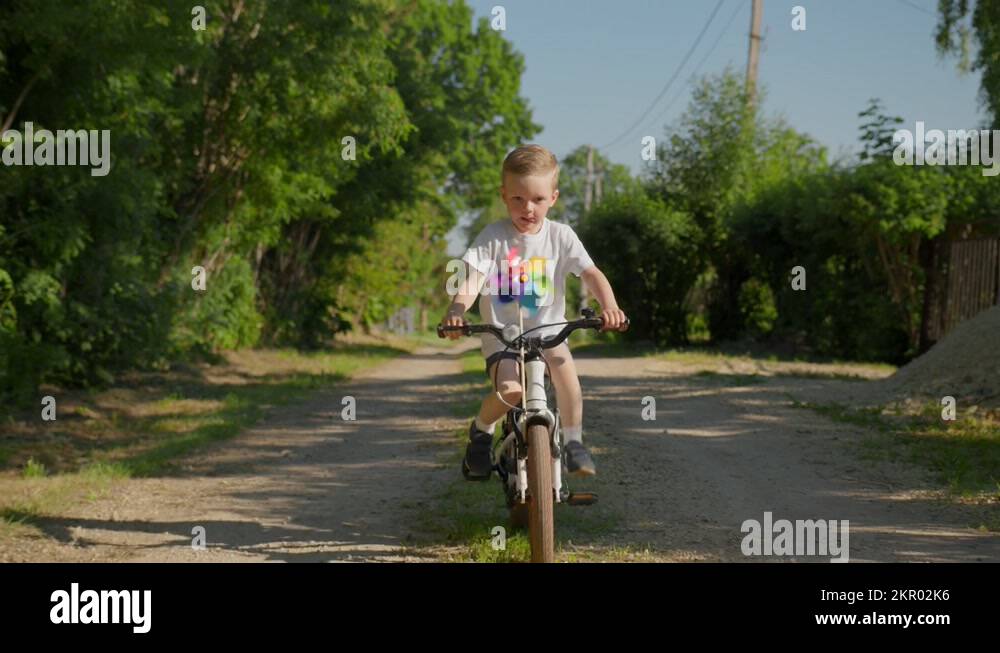 Kids riding bicycle on a country road Stock Videos & Footage - HD and ...