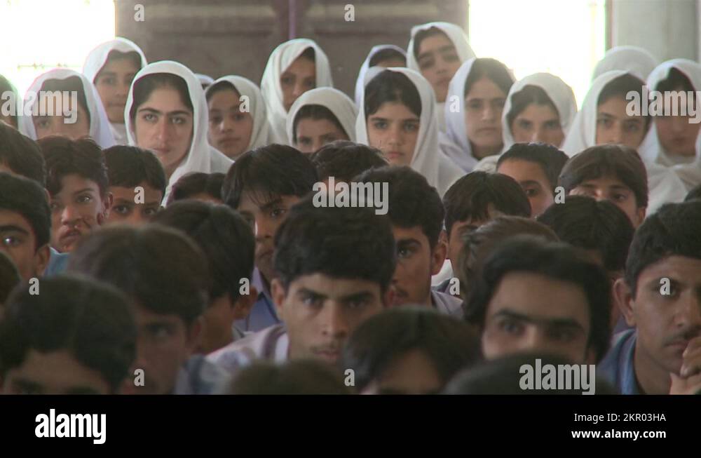Girls and boys in school assembly Stock Video Footage - Alamy