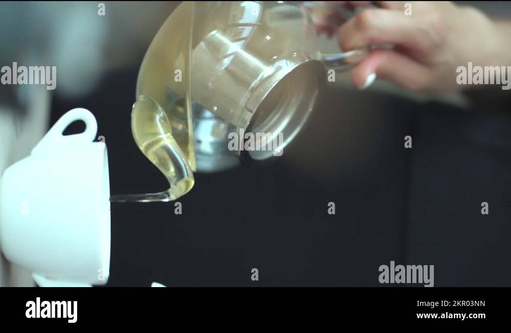 Tea pot pouring tea Stock Videos & Footage - HD and 4K Video Clips - Alamy