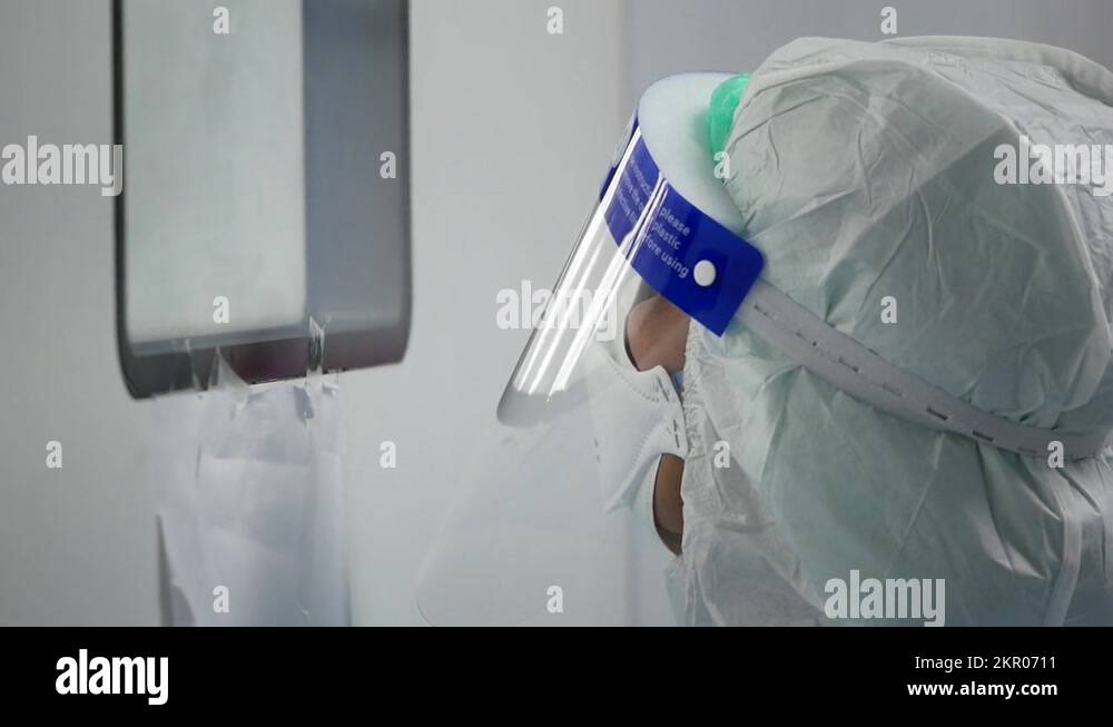 Asian Woman Wear PPE Look Inside Operating Room Window, Close Up Stock ...