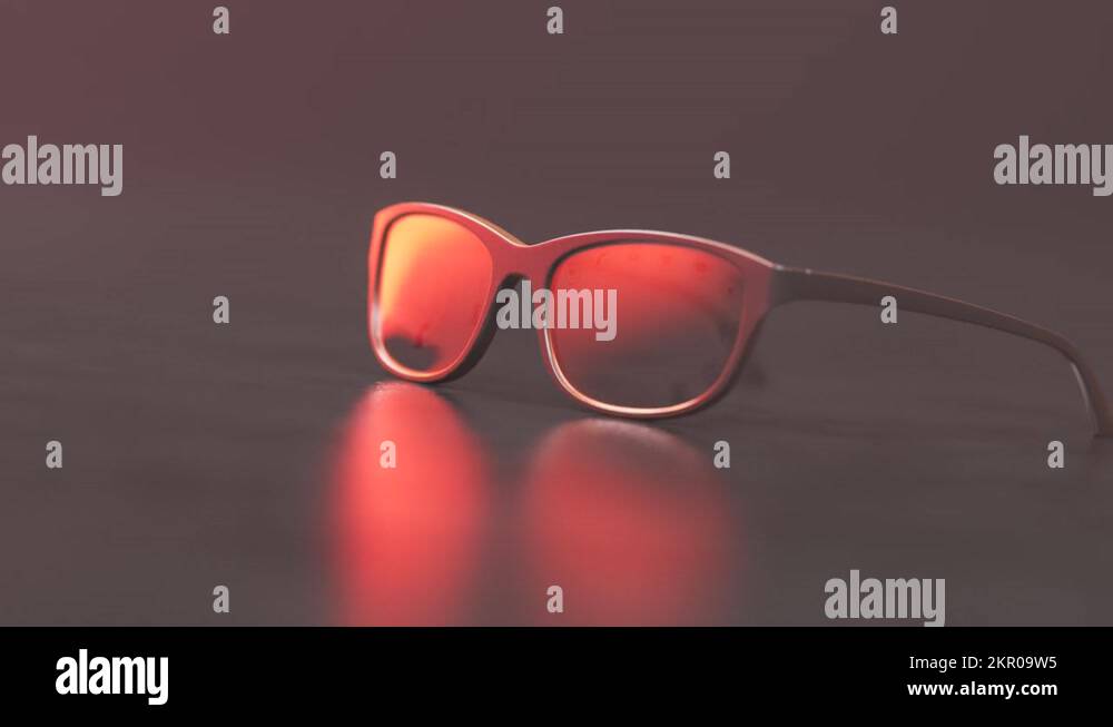 Pair Of Orange Smart Glasses Laying On Black Desk Ar Overlay Showing Functions Stock Video