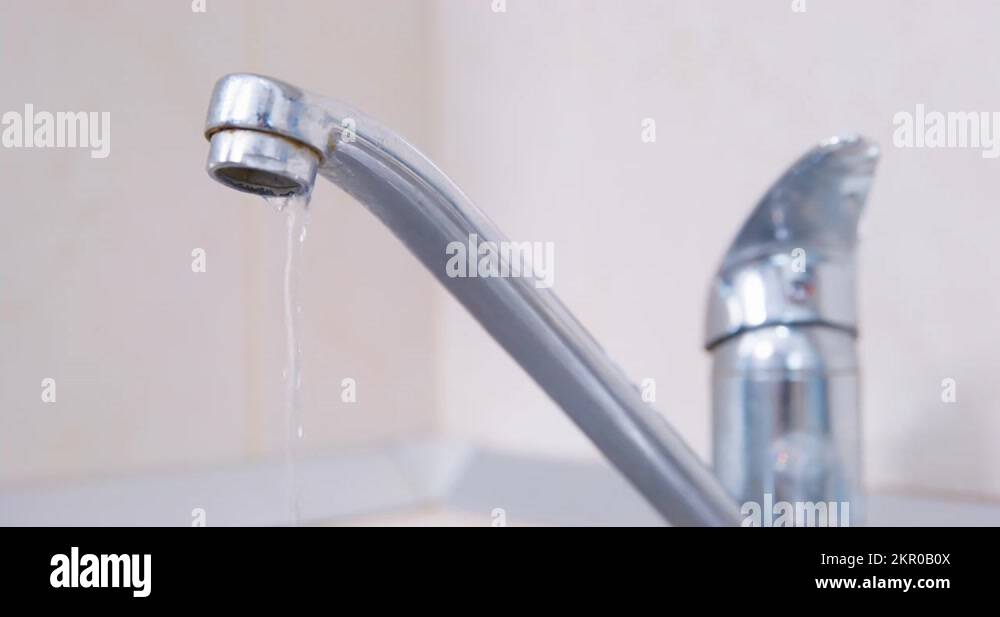 Faucet is fully open, but water barely flows out of it in thin trickle ...