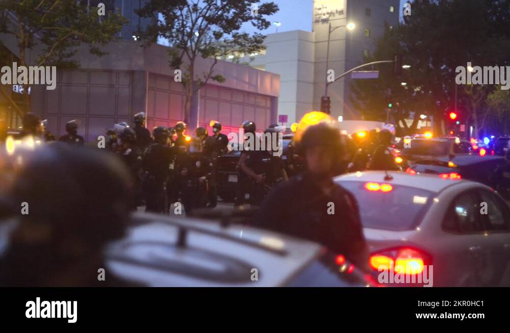 A large crowd of riot police assemble in the streets of Downtown at a ...
