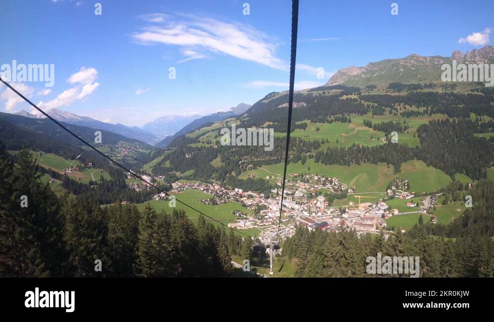 Cable car ride in canton Grisons Churwalden. The gondola lift descends ...