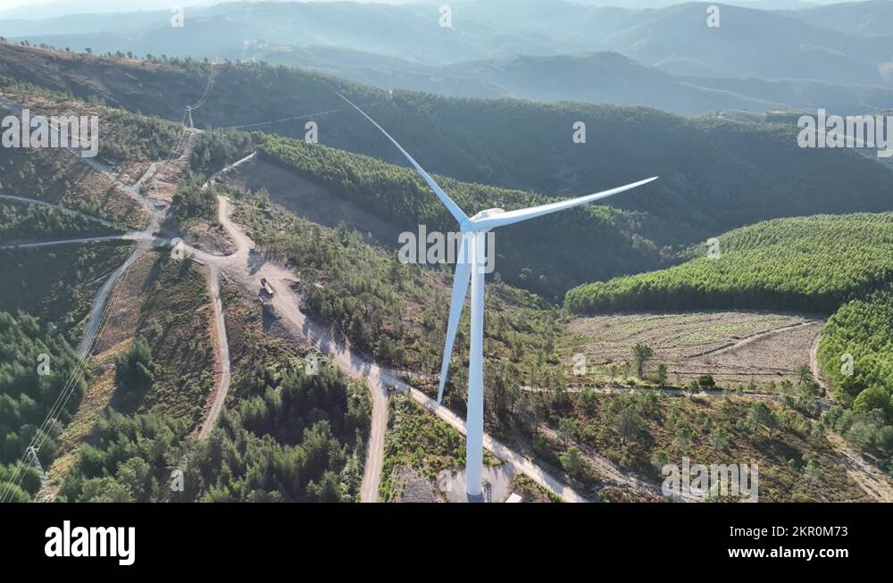 Stationary scene of a slow rotating wind turbine Stock Video Footage ...