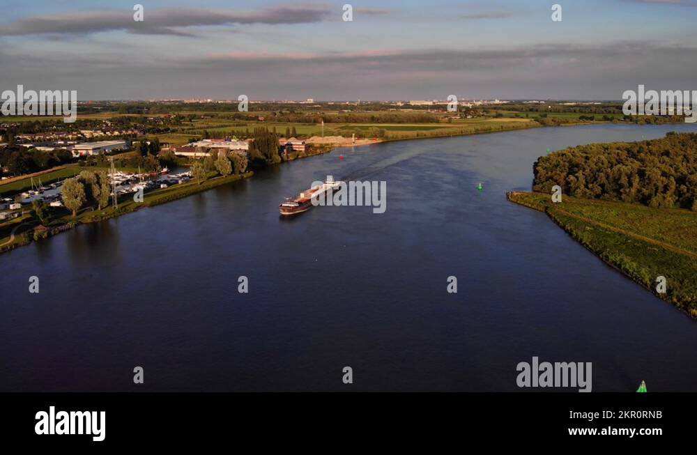 Drone View Of FPS Waal Cargo Container Vessel Approaching River Bend On ...