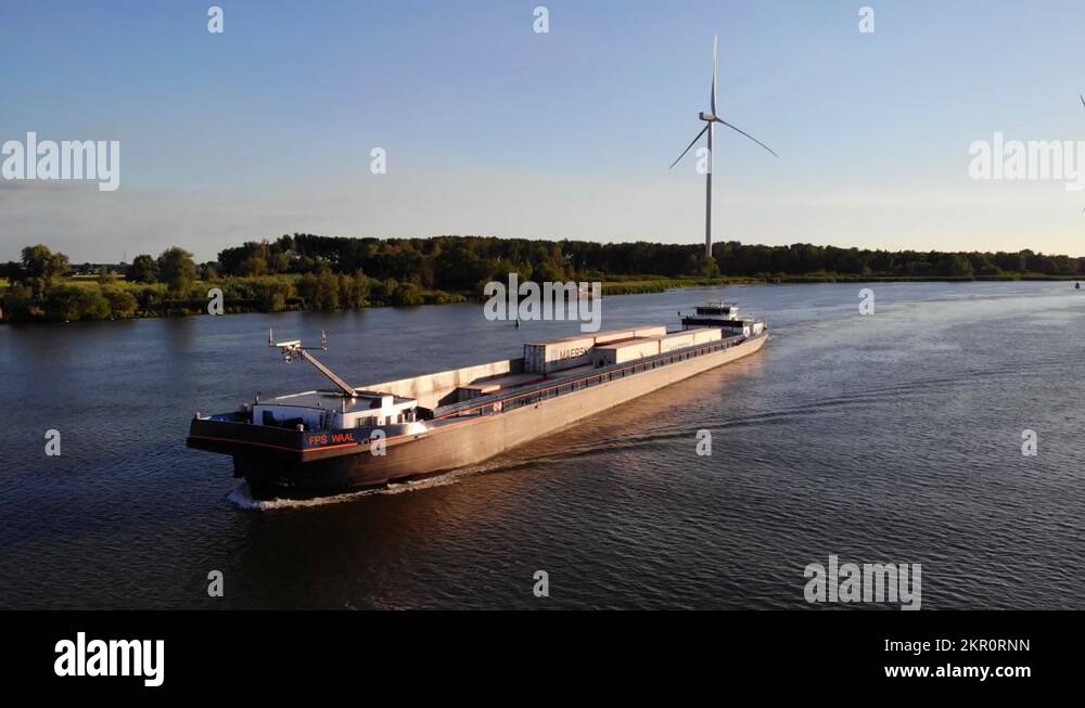 Aerial Port Side View Of FPS Waal Inland Cargo Vessel Along Oude Maas ...