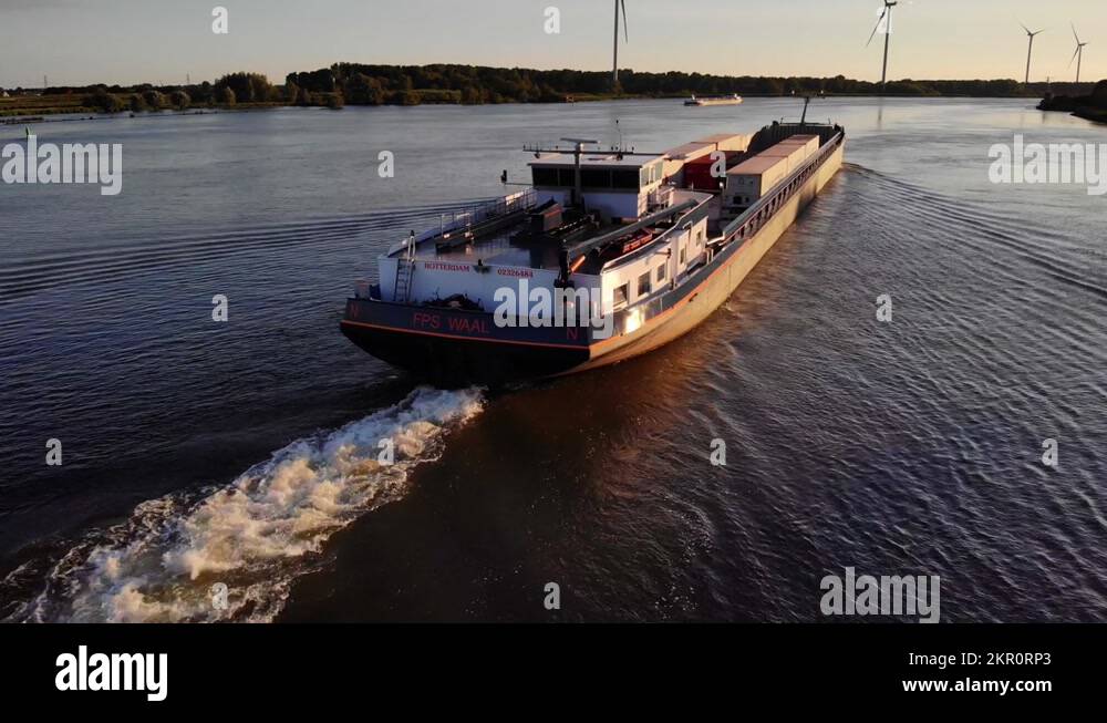 Aerial Stern View Of FPS Waal Inland Cargo Vessel Along Oude Maas With ...