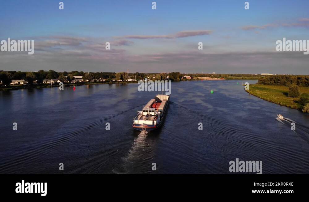 Aerial Stern View Of FPS Waal Inland Cargo Vessel Along Oude Maas With ...