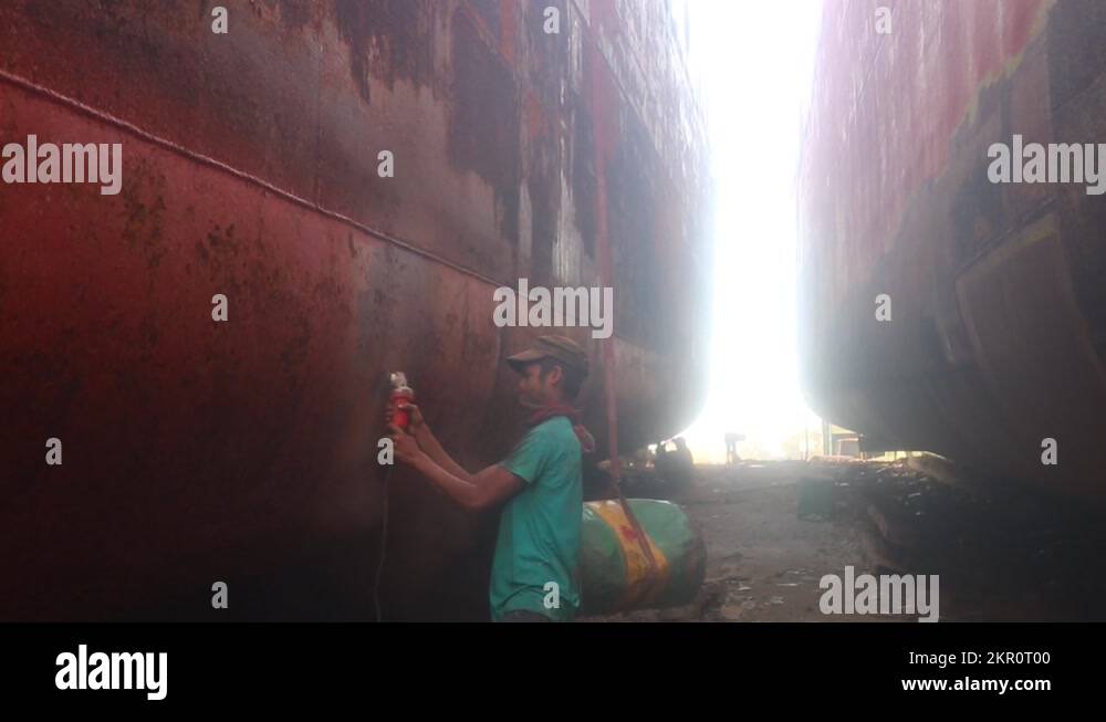 Bangledeshi Dock Worker Using Angle Grinder To Remove Rust From Ships ...