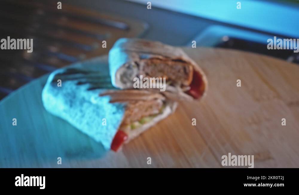 Ground Turkey Wrapburger Prepared And Cut Into Two Portions. rack focus ...
