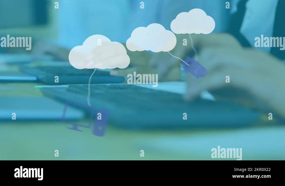 Composite of graphical clouds and computer icons over hands of ...