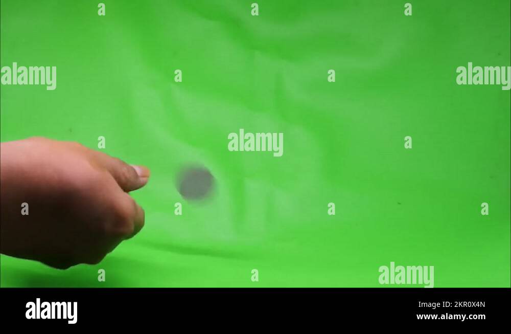 Realistic coins (Indonesian Rupiah) thrown with a green screen ...