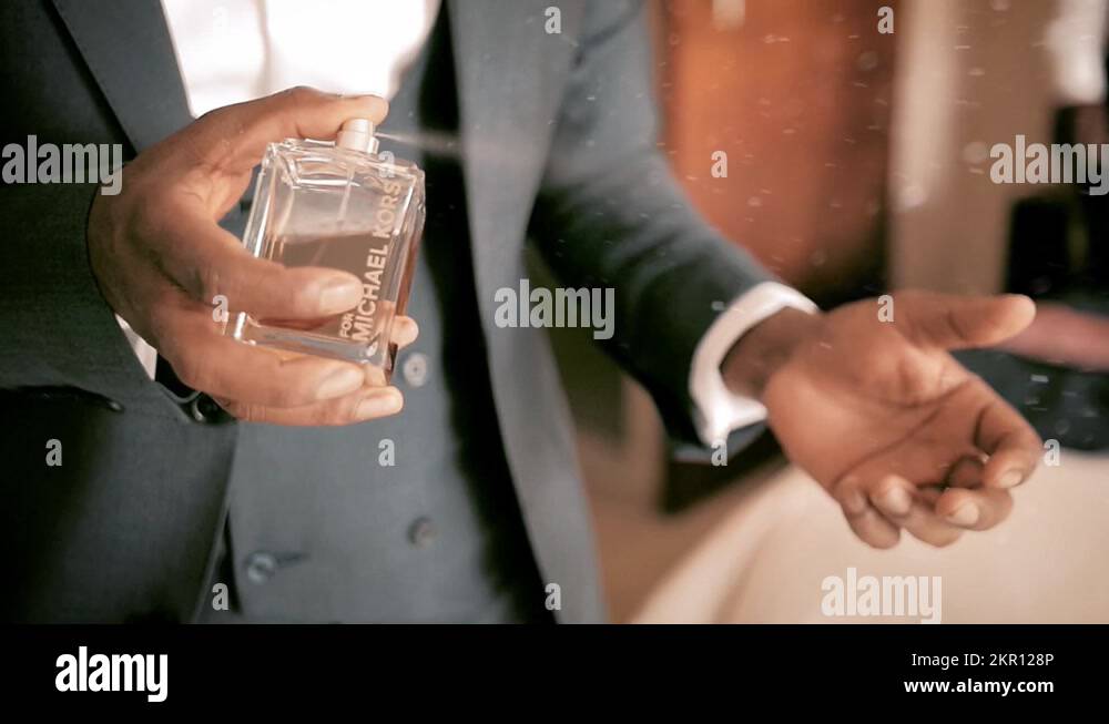 Successful Black African Man in a Smart Suit Spraying Cologne ...