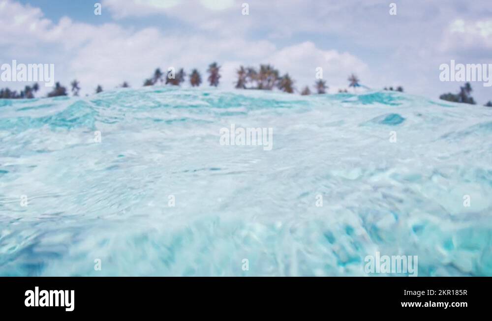Tropical blue sea with island. Splitted view of the tropical island and ...